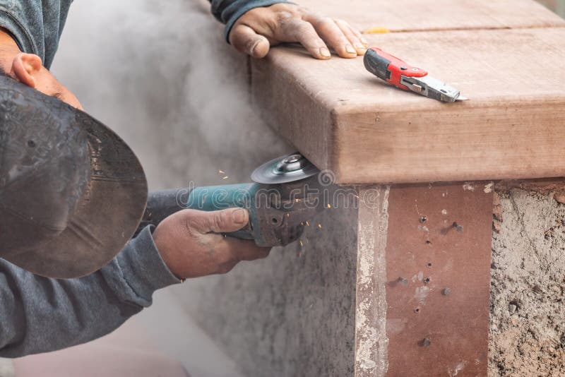 Construction Worker Using Grinder at Construction Site Stock Image ...