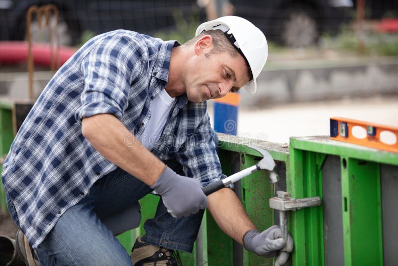 Construction Worker Using Hammer on Metal Bolt Stock Image - Image of ...