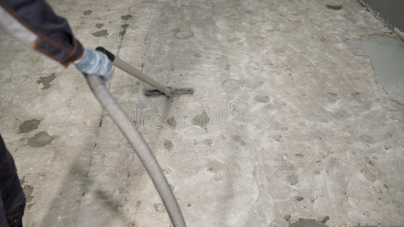 Construction Worker Cleaning Concrete Surface with Vacuum Cleaner Stock ...