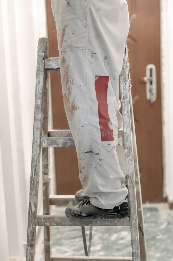 Construction Worker Using Ladder for Working on Home Renovations Stock ...
