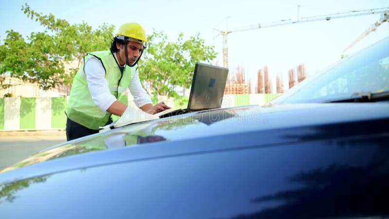 Construction Worker Using Laptop on Car Bonnet Stock Video - Video of ...