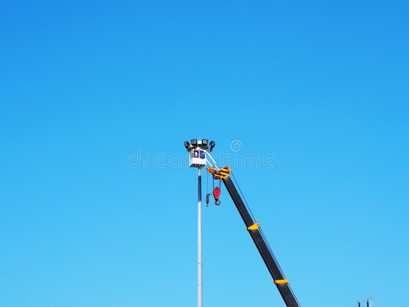 Construction Worker Using Lifting Boom on Blue Sky Stock Image - Image ...