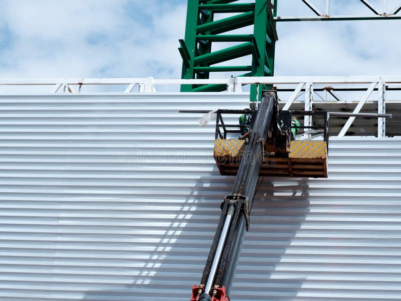 Construction Worker Using Lifting Boom Stock Image - Image of boom ...