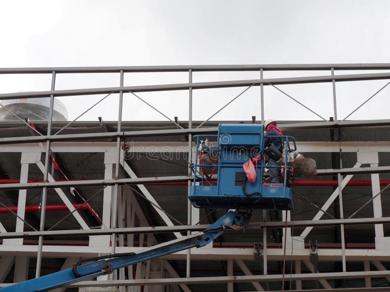 Construction Worker Using Lifting Boom Stock Image - Image of lifts ...