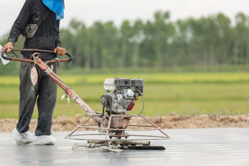 Construction Worker are Using the Machine To Polishing on the Cement ...
