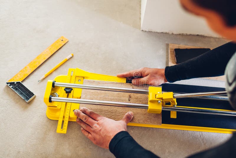 Construction Worker Using Manual Cutter Equipment for Laying Processing ...