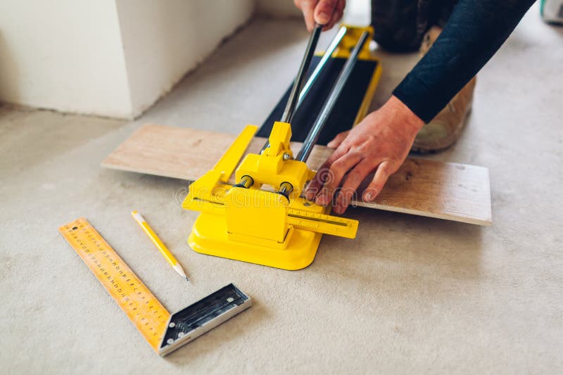 Construction Worker Using Manual Cutter Equipment for Laying Processing ...