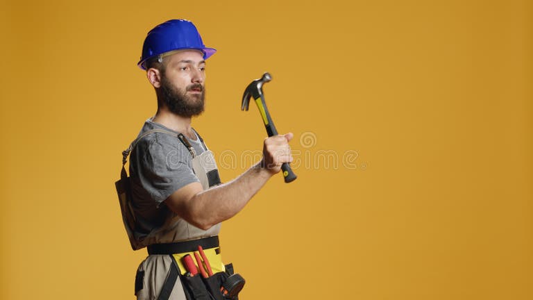 Construction Worker Using Manual Hammer To Hit Nails in Wall Stock ...