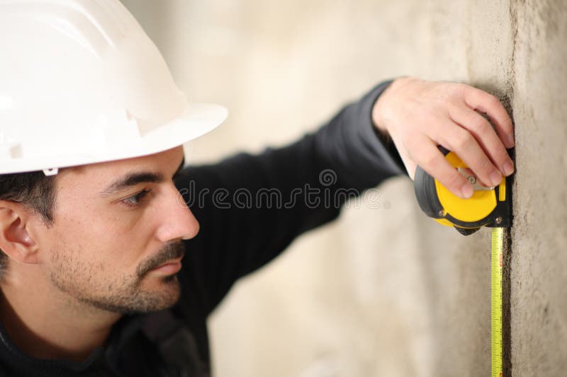 Construction Worker Using Measuring Meter Stock Photo - Image of ...