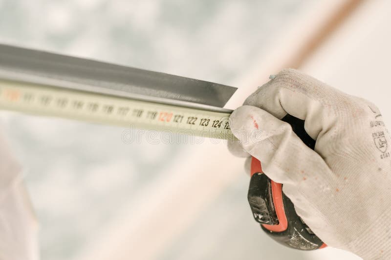 Construction Worker Using Measuring Tape Stock Photo - Image of object ...