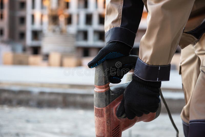 Construction Worker Using Power Drill on Site Stock Photo - Image of ...