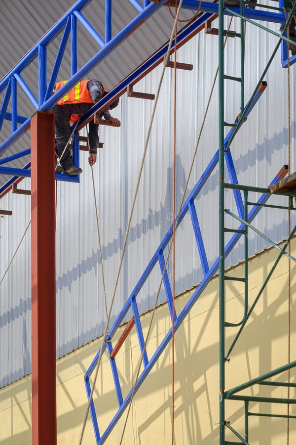 Construction Worker Using Rope To Lifting Metal Framework for Install ...