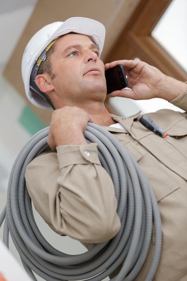Construction Worker Using Smartphone Stock Image - Image of uniform ...