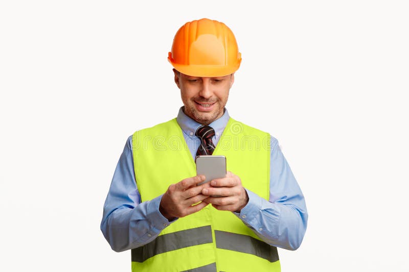 Construction Worker Using Smartphone Standing on White Studio ...
