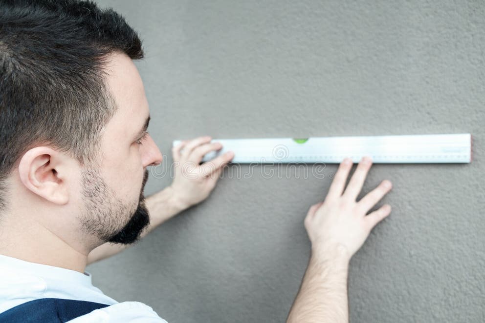 Construction Worker Using Spirit Level Stock Photo - Image of ...
