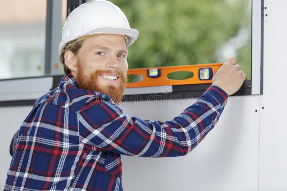 Construction Worker Using Spirit Level in New House Stock Image - Image ...