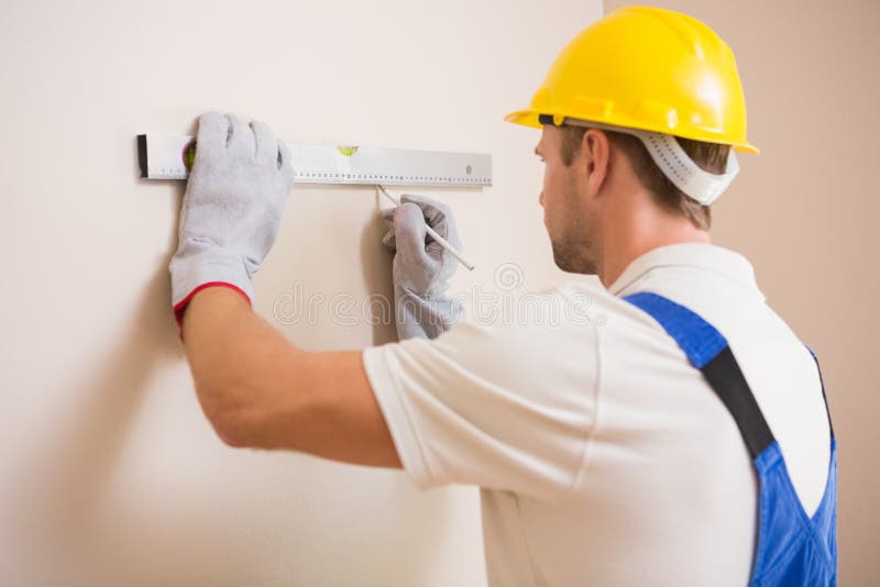 Construction Worker Using Spirit Level Stock Image - Image of wear ...