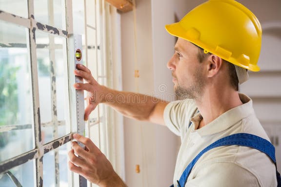 Construction Worker Using Spirit Level Stock Photo - Image of ...