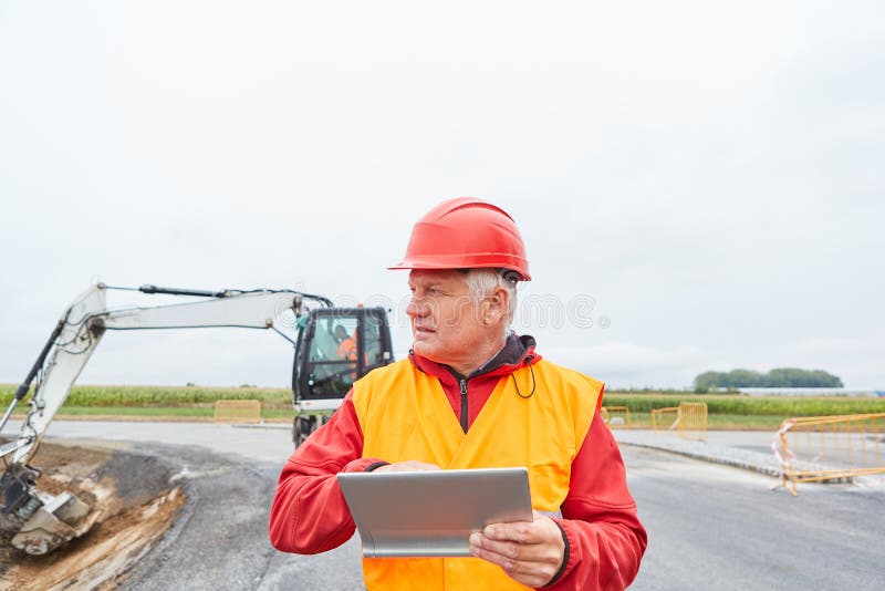 Construction Worker with a Computer Stock Image - Image of online ...