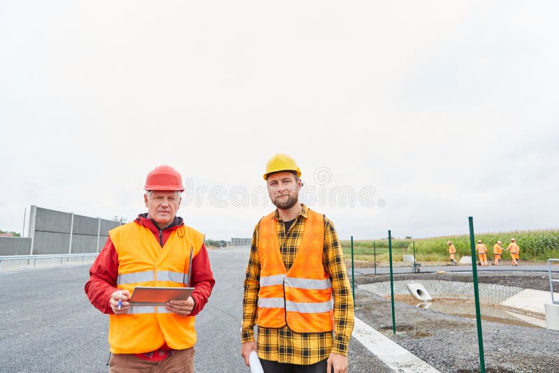 Construction Worker Using Tablet Computer on Construction Site Stock ...