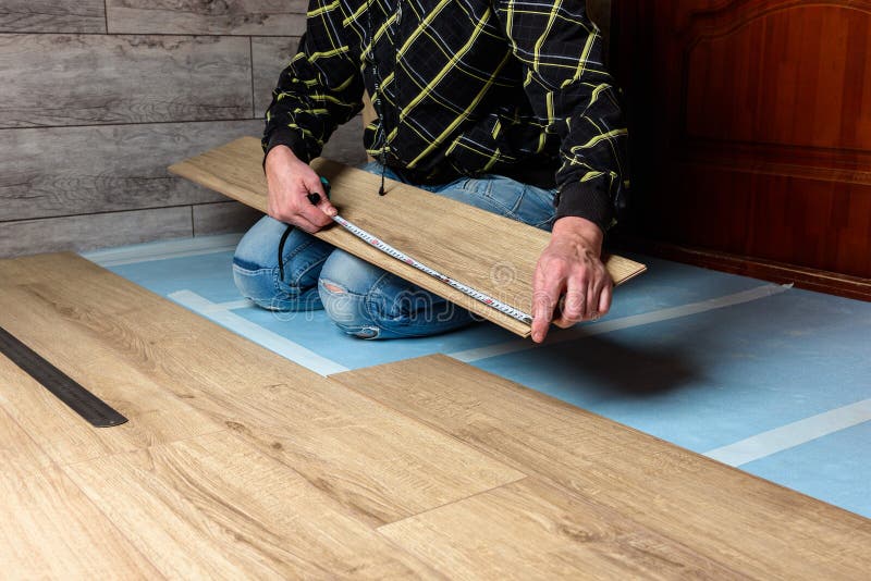 Construction Worker Using Tape Measure Ruler Measuring Laminate Board ...