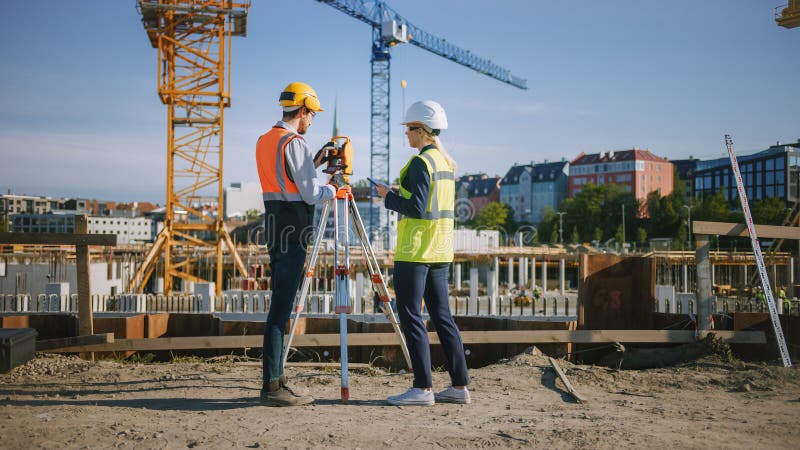 Construction Worker Using Theodolite Surveying Optical Instrument for ...
