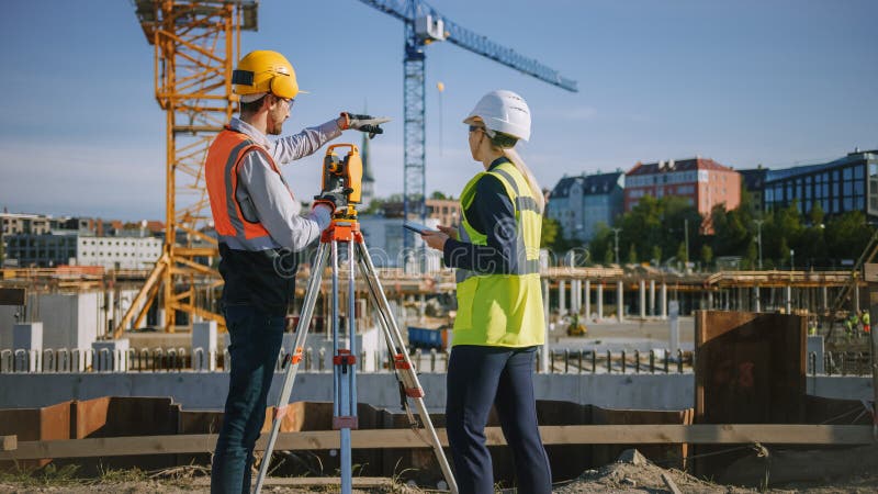 Construction Worker Using Theodolite Surveying Optical Instrument for ...