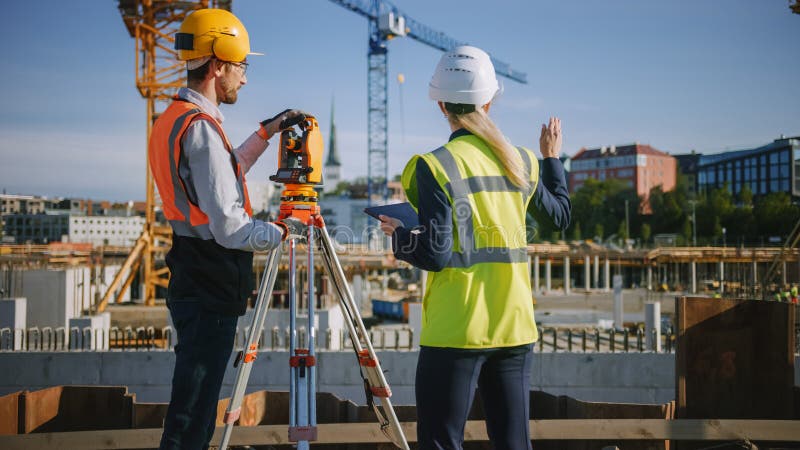 Construction Worker Using Theodolite Surveying Optical Instrument for ...