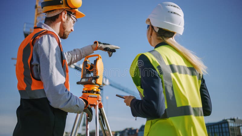 Construction Worker Using Theodolite Surveying Optical Instrument for ...