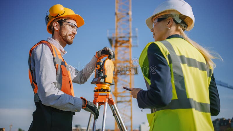 Construction Worker Using Theodolite Surveying Optical Instrument for ...