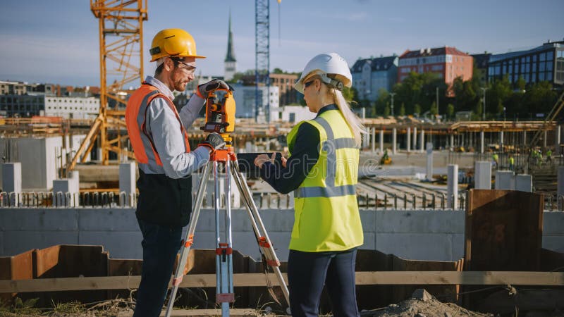 Construction Worker Using Theodolite Surveying Optical Instrument for ...