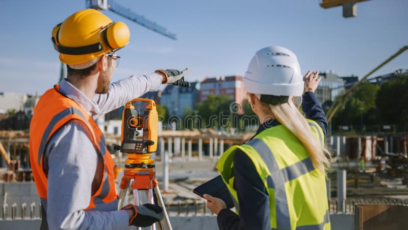 Construction Worker Using Theodolite Surveying Optical Instrument for ...