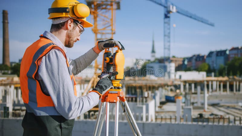 Construction Worker Using Theodolite Surveying Optical Instrument for ...