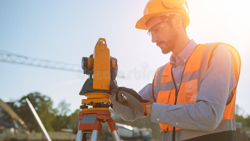 Construction Worker Using Theodolite Surveying Optical Instrument for ...