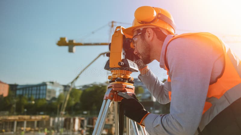 Construction Worker Using Theodolite Surveying Optical Instrument for ...