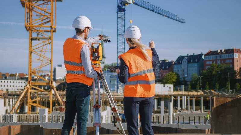 Construction Worker Using Theodolite Surveying Optical Instrument for ...