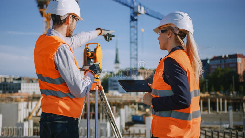 Construction Worker Using Theodolite Surveying Optical Instrument for ...