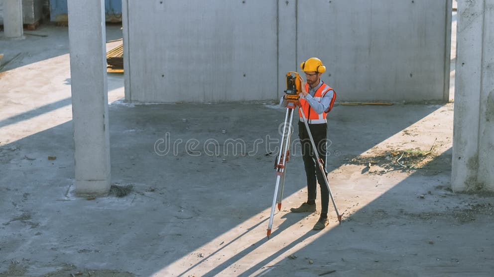 Construction Worker Using Theodolite Surveying Optical Instrument for ...
