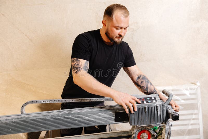 Construction Worker Using Tile Saw Cutting Machine Preparing Ceramic ...