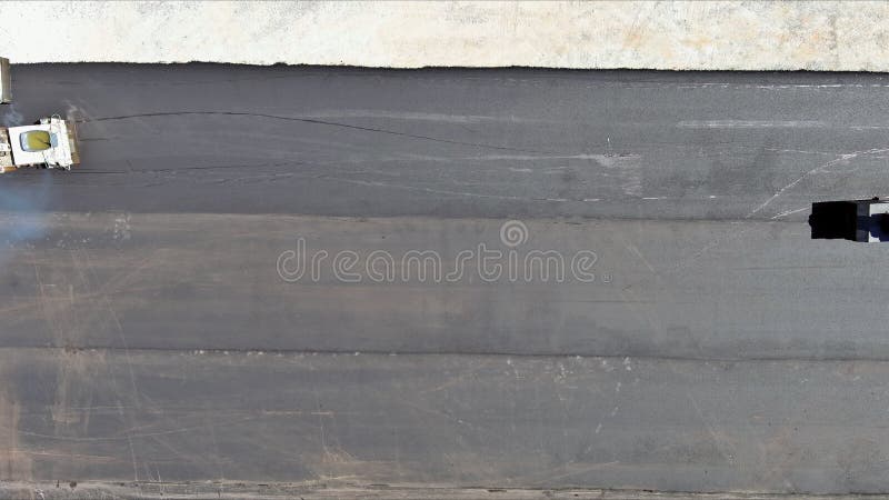 A Construction Worker in a Vibratory Road Roller Compactor Machine ...