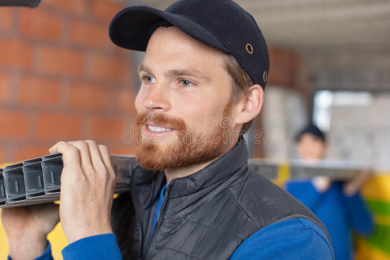 Construction Worker Wearing Hard Hat Holding Bar Stock Image - Image of ...
