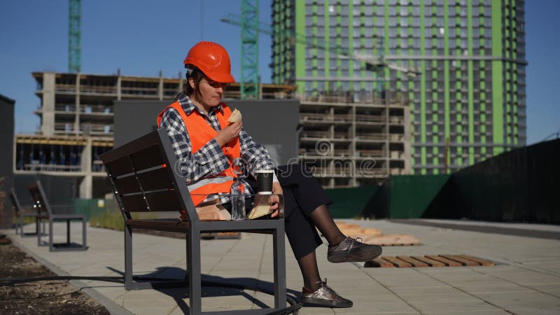 A Construction Worker is Enjoying a Relaxing Break at the Job Site ...