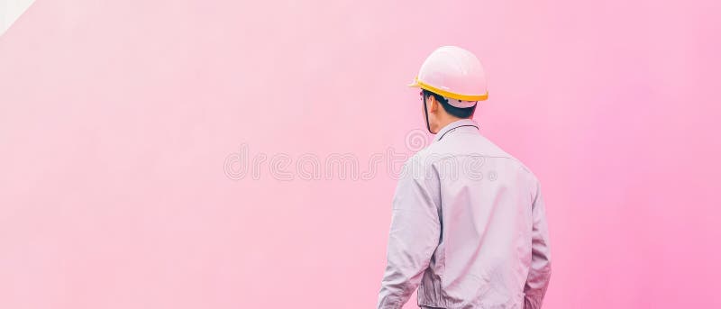 Worker in Helmet Stands before Pink Wall Stock Image - Image of ...