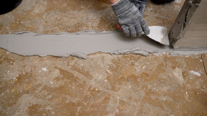 Construction Worker Applying Cement on the Floor Using Trowel Stock ...