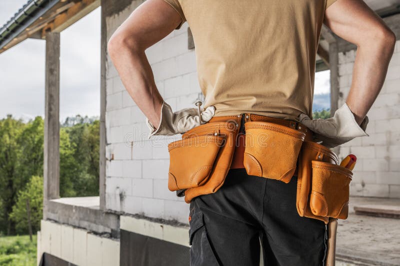 Construction Worker Wearing Tools Belt at a Building Site during Daylight Stock Photo - Image of ...