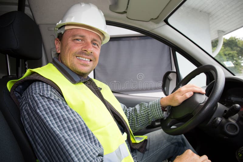 Construction Worker, Wearing a White Helmet in a Car Driving Stock ...
