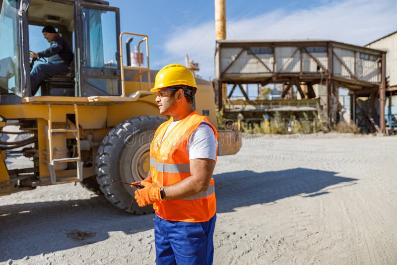 Experienced Worker is Regulating Production Process Outdoors Stock ...