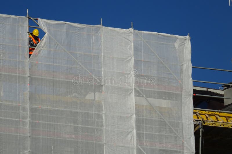 Construction Worker at Work on a Building in Renovation on a ...
