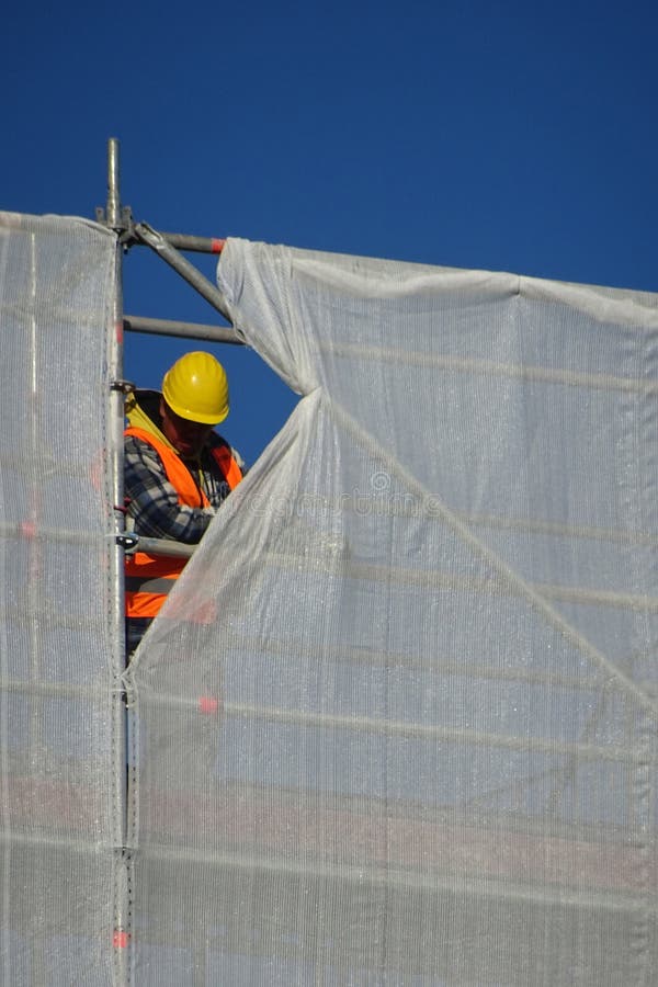 Construction Worker at Work on a Building in Renovation on a ...