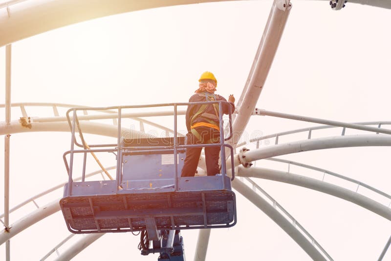 Construction Worker Work at High Construction Roof on Crane Platform ...
